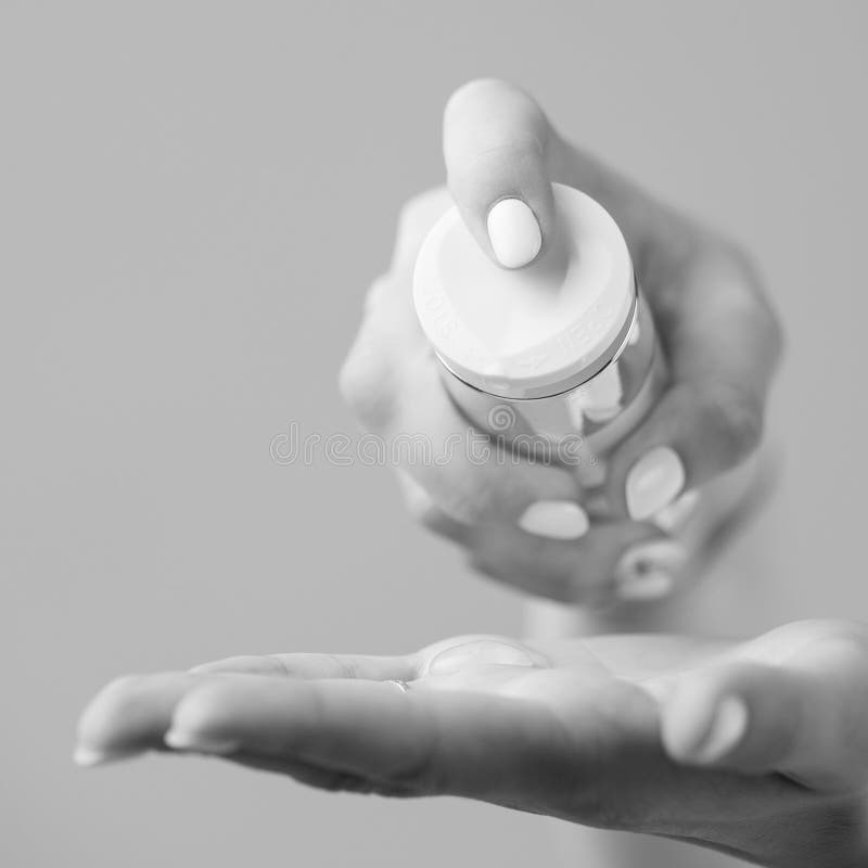 A Girl In The Bathroom Takes Care Of Her Skin And Applies Cream To Her