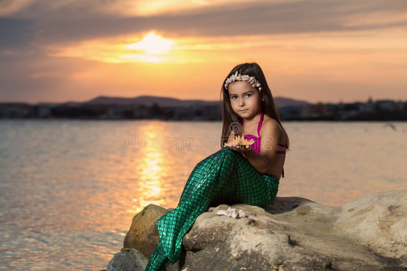 Girl on the Beach and Setting Sun Stock Photo - Image of beach, ocean ...
