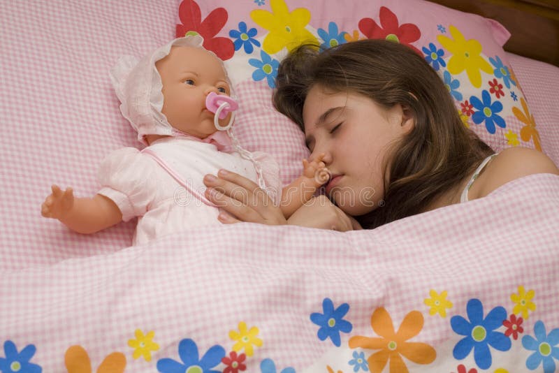 Girl in bed with a doll stock photo. Image of comfortable - 9452418