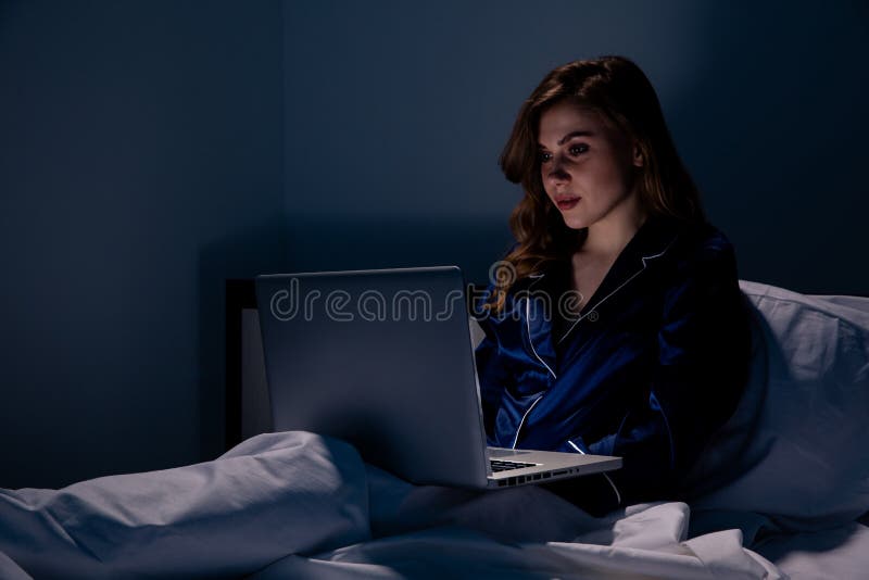 Girl in the Bed at Night Working on the Computer. Stock Photo - Image ...