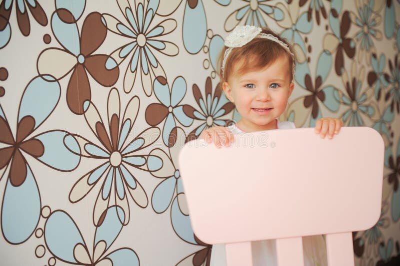 Girl Behind Chair stock image. Image of chair, childhood - 48302855
