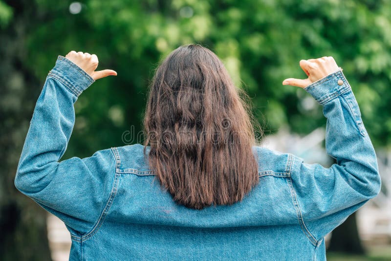 Girl from behind with okay stock photo. Image of satisfied - 258896924