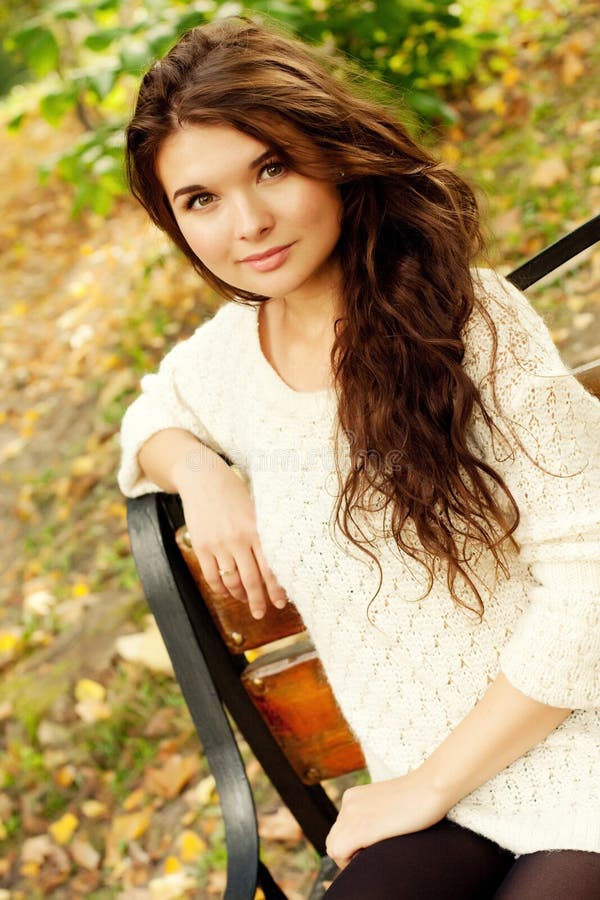 Girl On Bench In Autumn Park Stock Image - Image of girl, person: 36525489