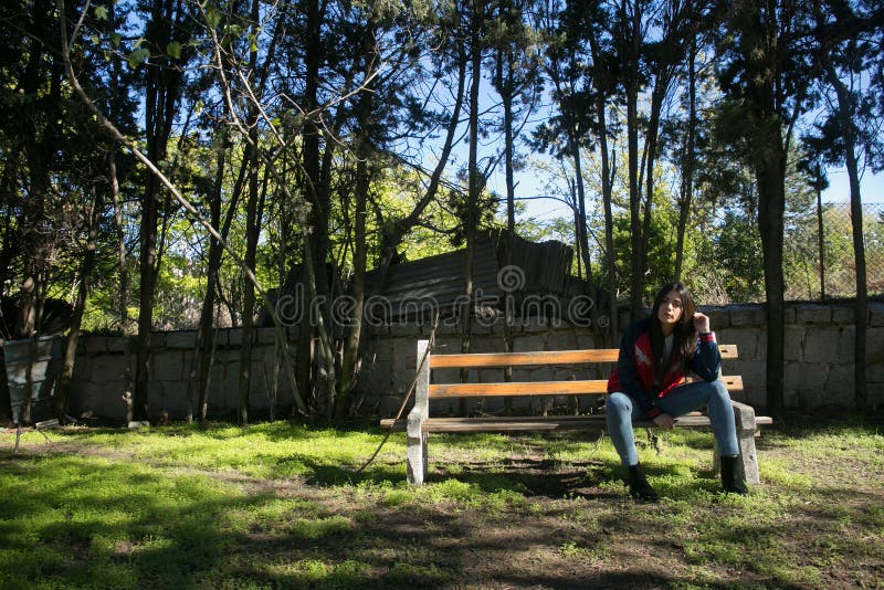 Girl in a bench stock image. Image of cute, white, young - 80958567
