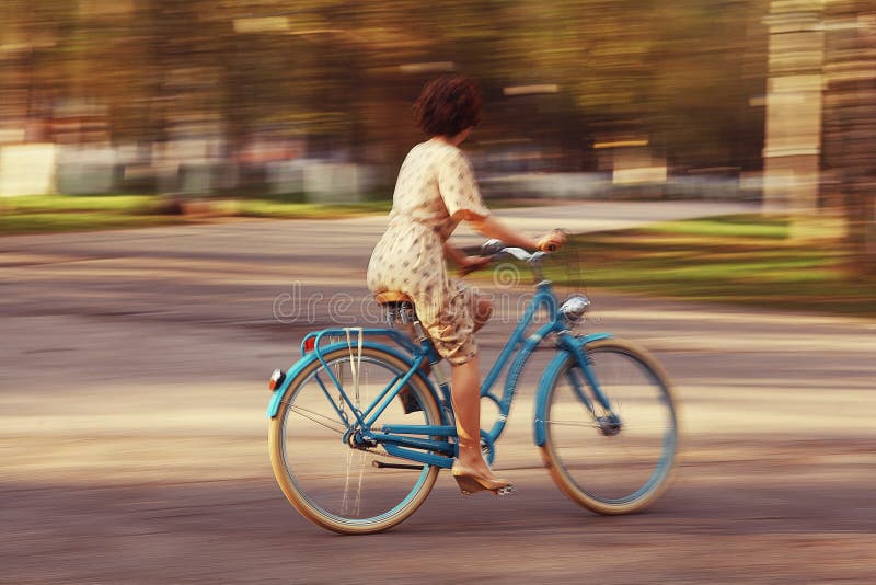 Girl on a Bicycle in Movement Stock Photo - Image of drive, girl: 63541644