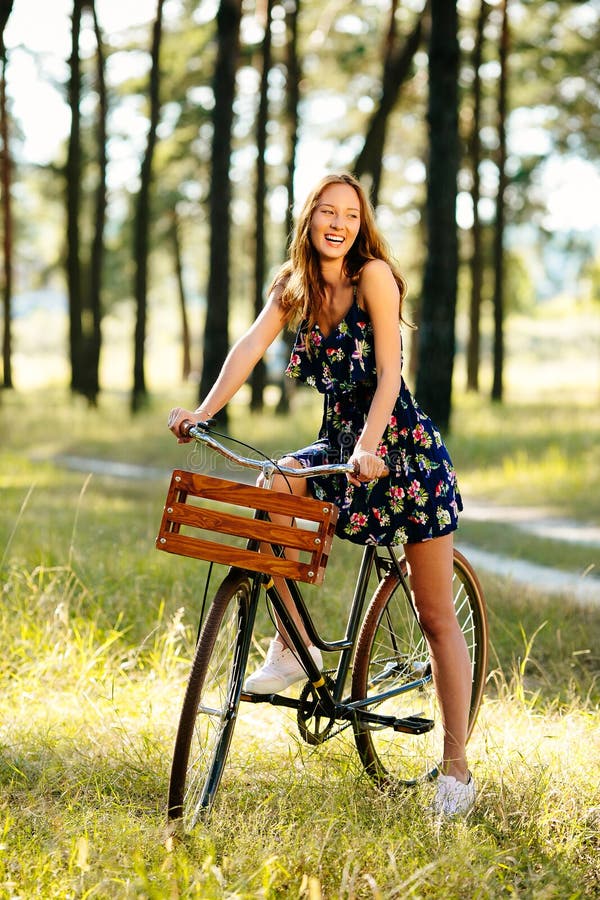 Girl on a Bicycle in the Woods Stock Photo - Image of dress, bike ...