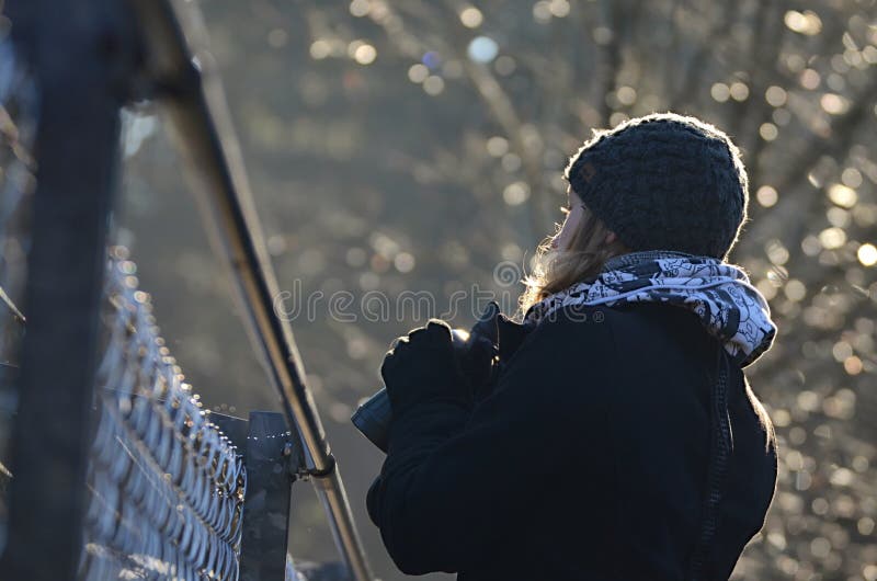 Girl with Binoculars Looking Over Wire Fence Stock Image - Image of ...