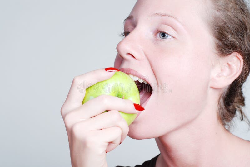 The Girl Biting An Apple Picture. Image: 5350798