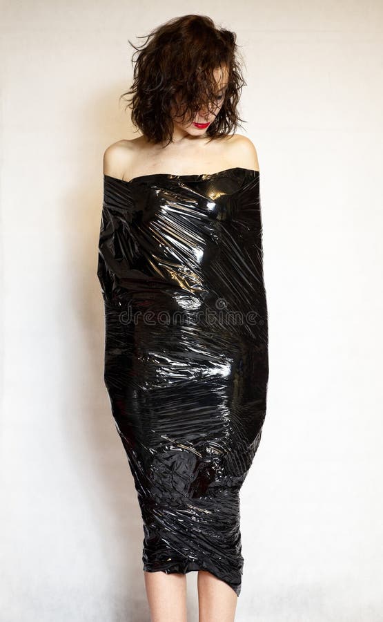 Girl in black foil stock image. Image of model, confined - 87841835