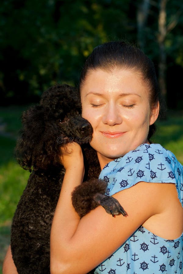 Girl with black poodle stock image. Image of girls, environmental ...