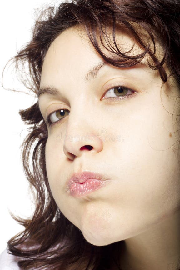 Girl Blowing Her Cheeks stock image. Image of cheeks - 13101007