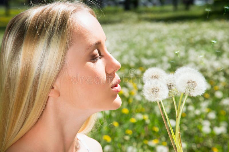 Girl Blowing on White Dandelion Stock Image - Image of green, flower ...