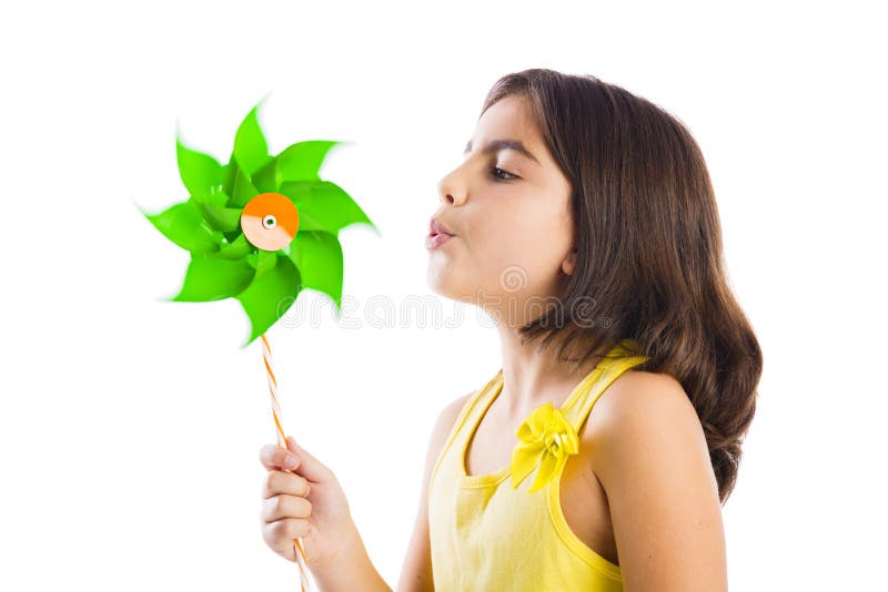 Girl blowing a windmill stock image. Image of children - 85358929 Girl blowing a windmill stock image. Image of children - 85358929