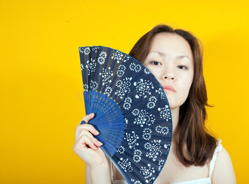 Girl and blue fan stock photo. Image of young, casual - 14600588