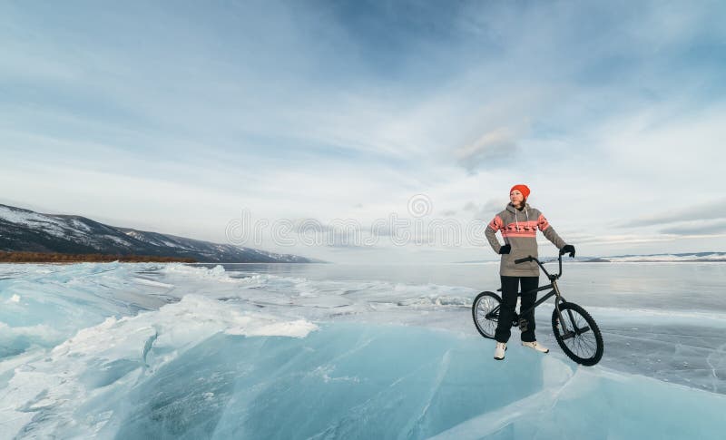 Girl on a bmx on ice. stock image. Image of nature, lake - 71159749