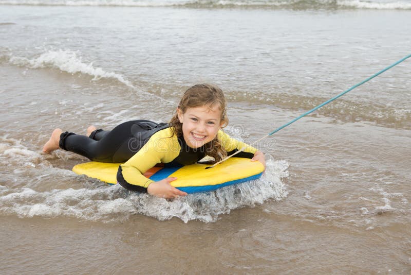 Girl Bodyboarding stock image. Image of bodyboarding - 50298249