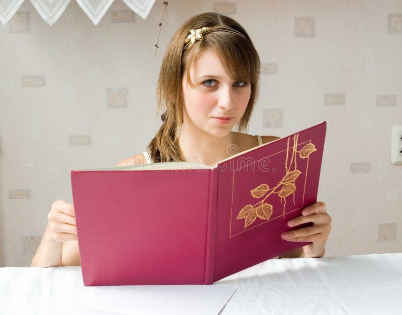 Girl Behind Table Reads Book Stock Photos - Free & Royalty-Free Stock ...
