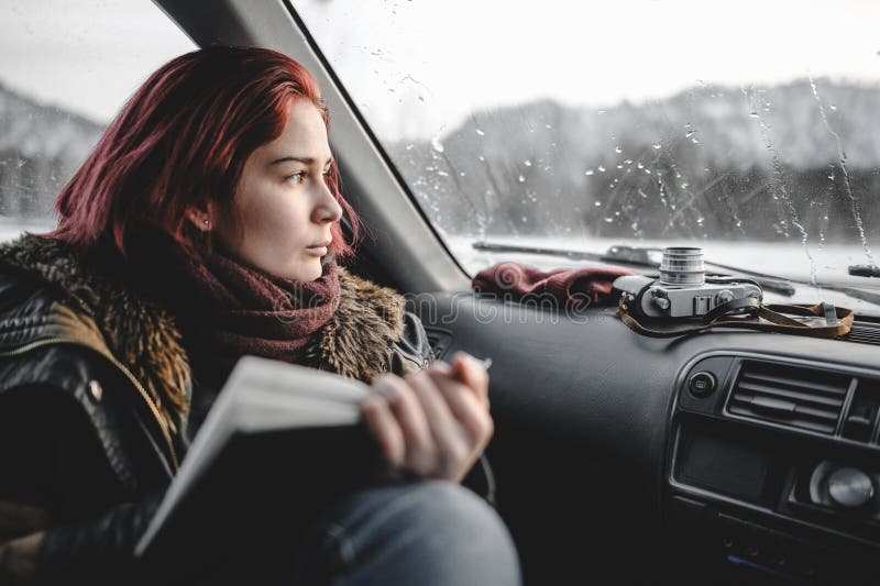 Girl with book in the car stock image. Image of interest - 112569083