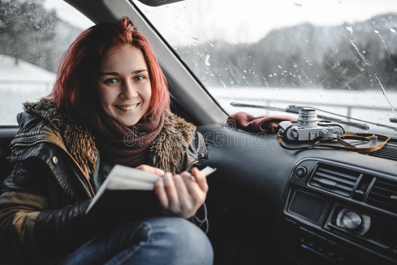 Girl with book in the car stock photo. Image of drive - 112569100