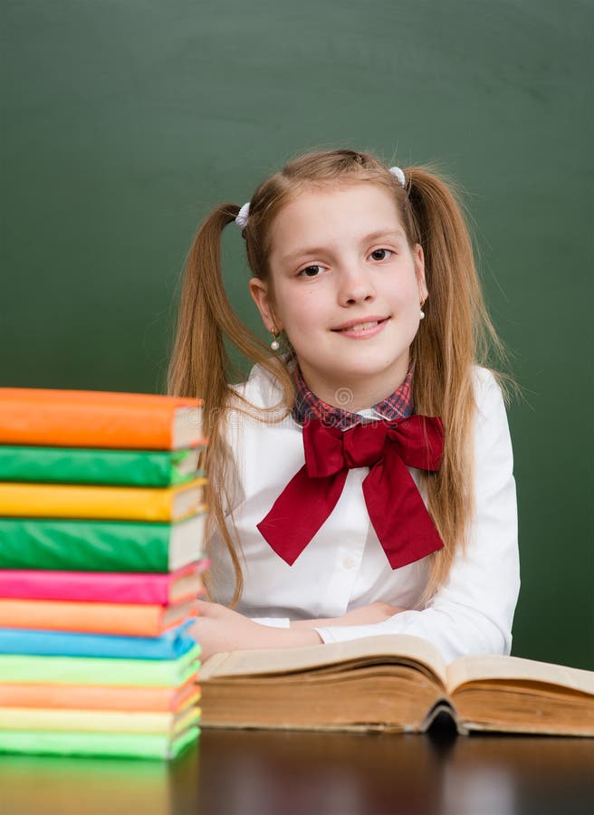 Girl with a Book in Classroom Stock Image - Image of looking, smile ...