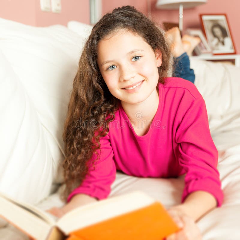 Girl with a book stock image. Image of casual, hair, couch - 42614139
