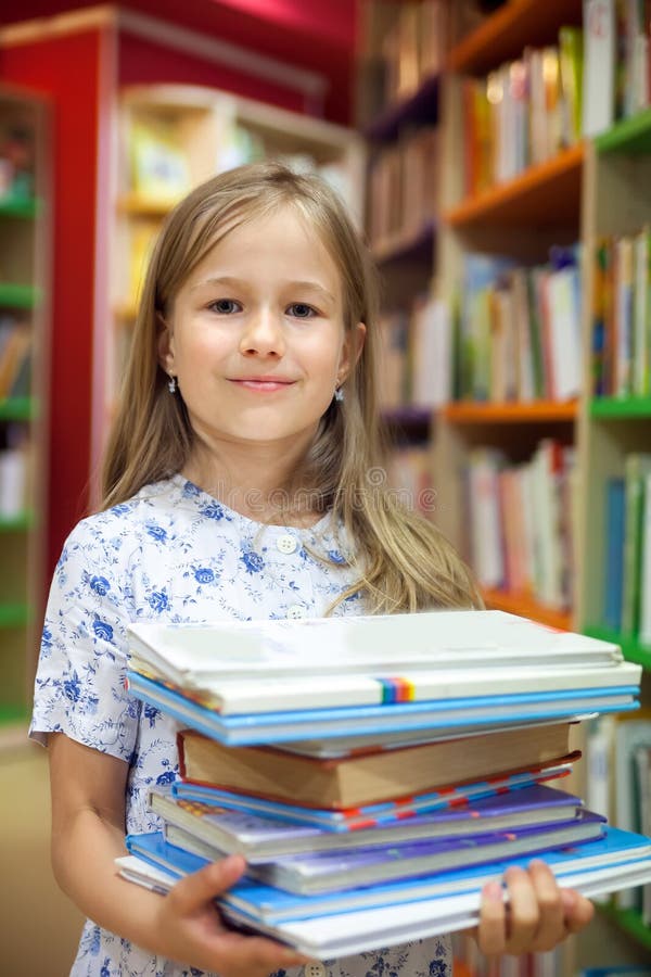 Girl with Books between Shelves in Library Stock Image - Image of ...