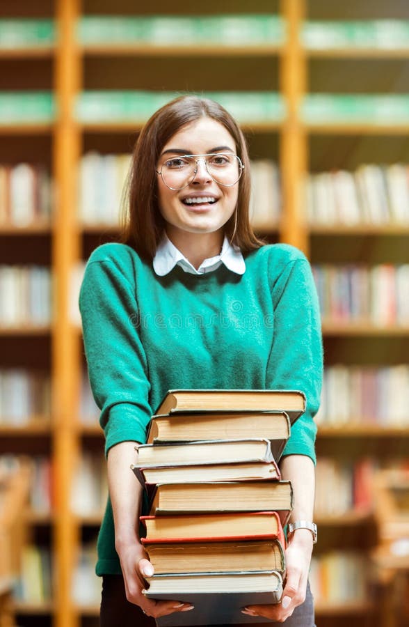 Girl with the Books Stack stock image. Image of holding - 112840947