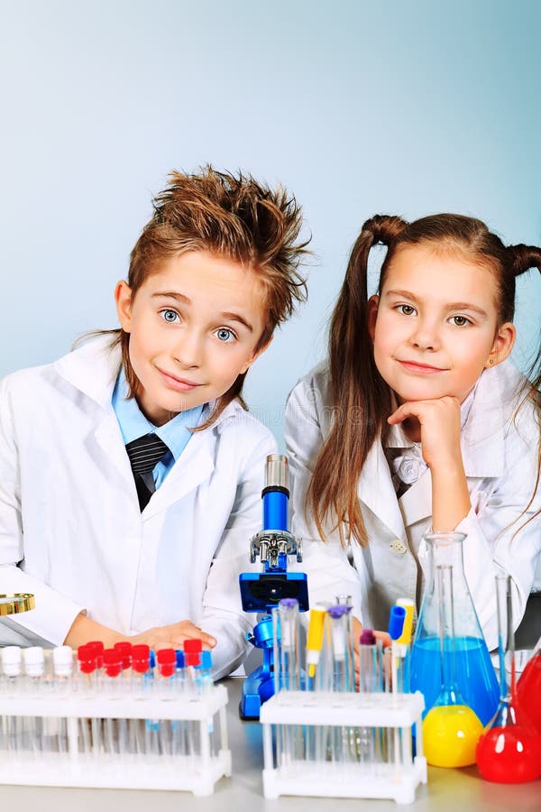 Male and Female Teenage Student in Science Class Stock Photo - Image of ...
