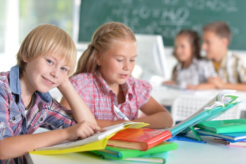 Girl and boy doing lessons stock photo. Image of cute - 88352830