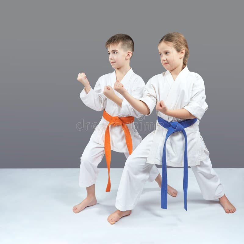 A Girl and a Boy in Karategi Stand in a Karate Rack Stock Image - Image ...