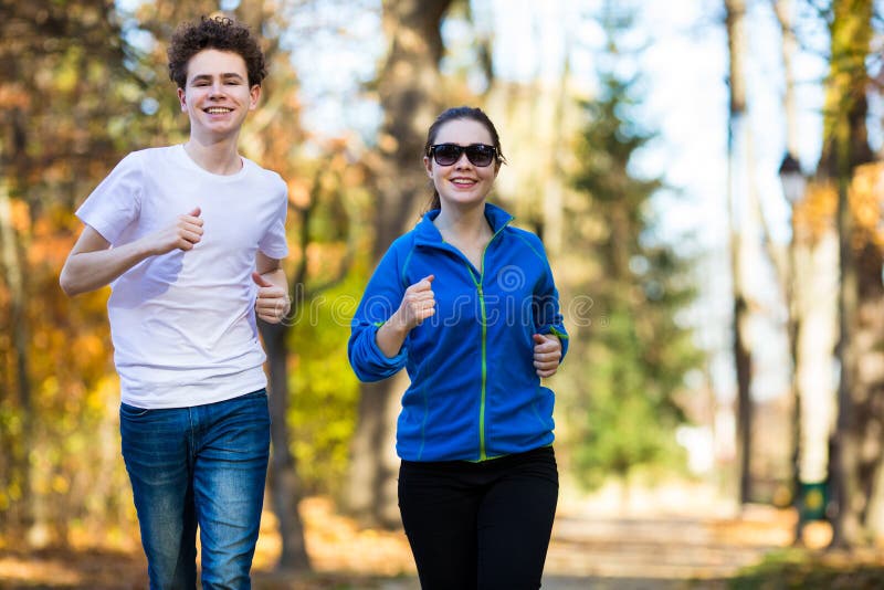 Girl and Boy Running, Jumping in Park Stock Photo - Image of girls ...