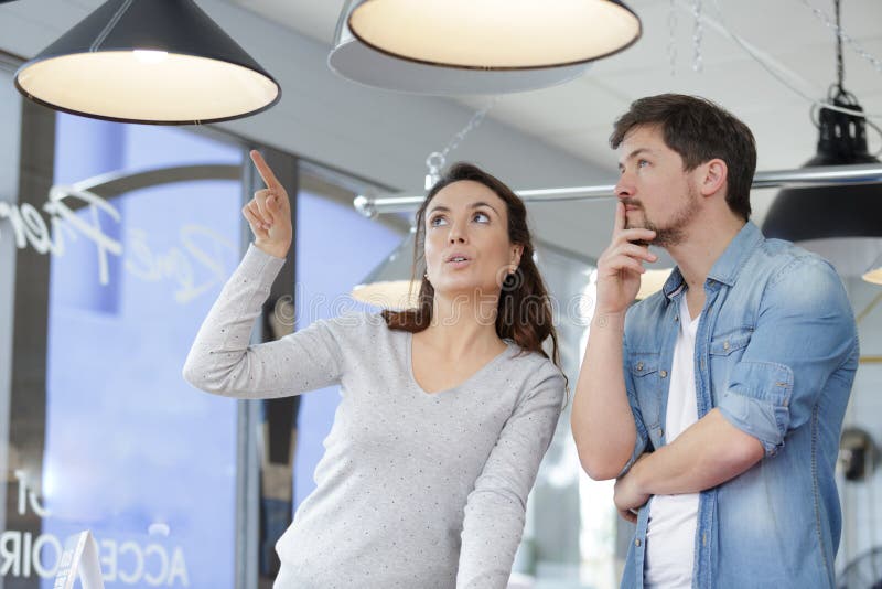 Girl with Boyfriend in Search Table Lamp Stock Photo - Image of lamps ...
