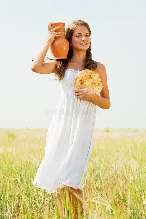 Girl with bread and jug stock photo. Image of organic - 15349350