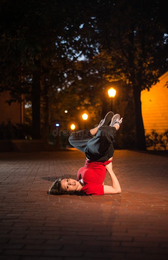 Girl breakdancing at night stock image. Image of music - 28059919