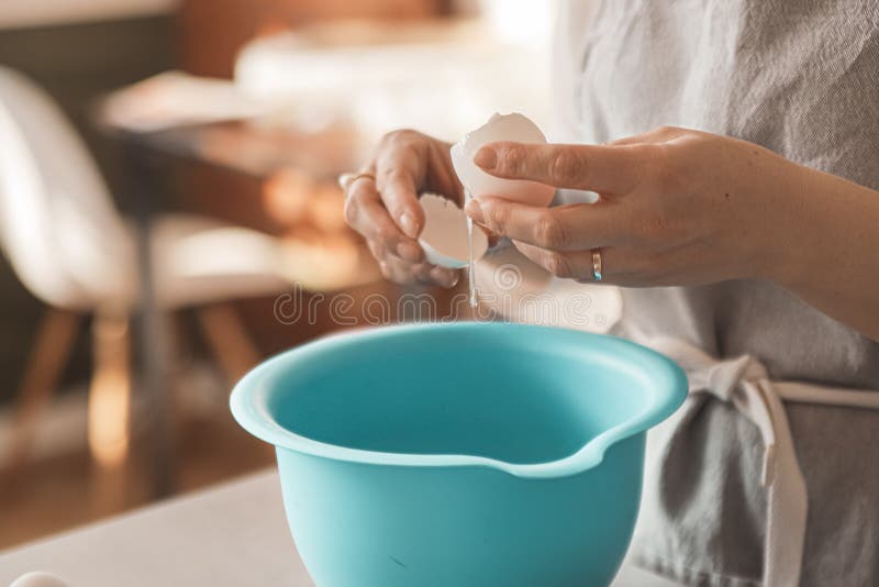 Girl Breaks an Egg into a Bowl for Baking. Culinary Cover Stock Photo ...