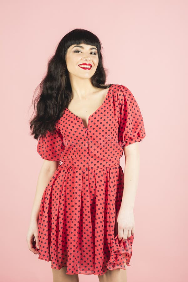 Girl With Brunette Hair In Red Dress With Polka Dot Stock Image
