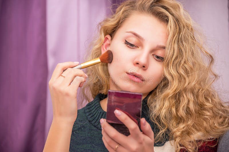 Girl Doing Makeup on Her Face Stock Photo - Image of looking, feminine ...