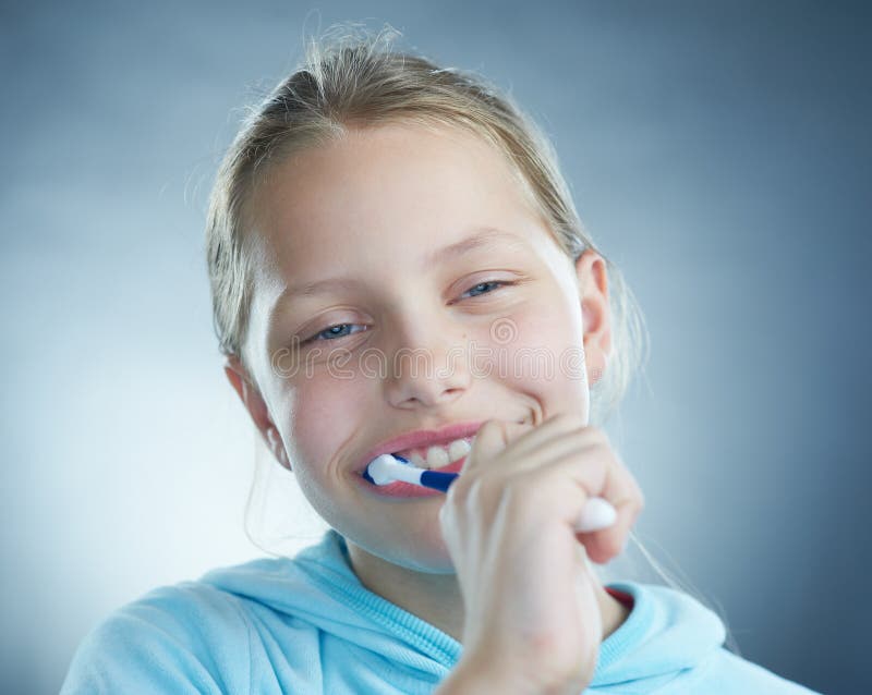 Girl brushing teeth. stock photo. Image of caucasian - 26951908