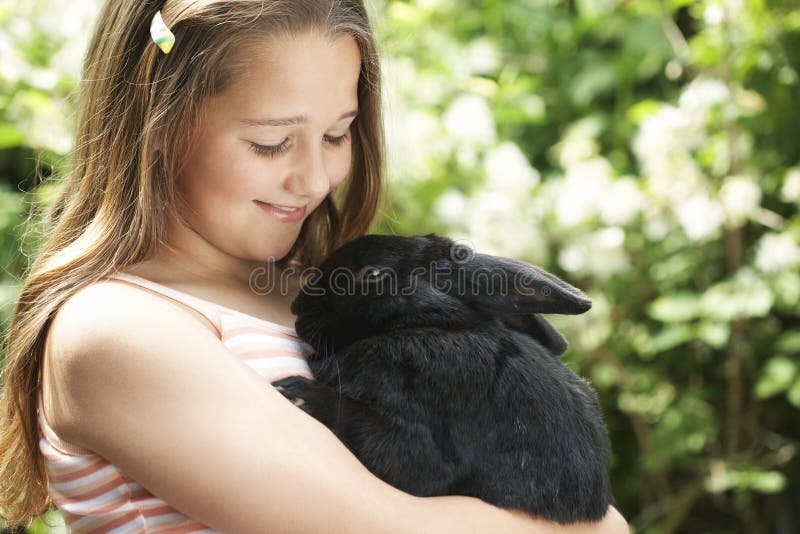 Girl with Bunny Rabbit stock photo. Image of girl, holding - 31836038