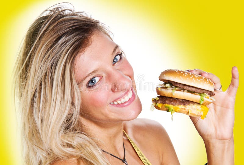 Girl with burger in hand stock image. Image of burger - 86124469