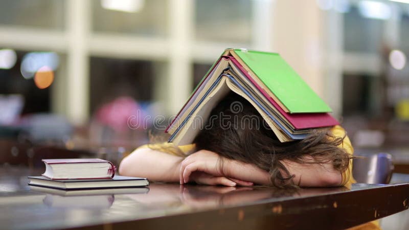 Girl Buried Under Book Stack Stock Footage - Video of book, woman: 37959249