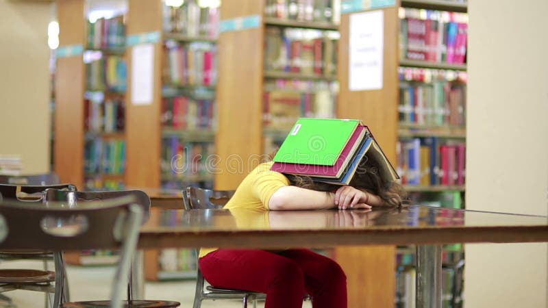 Girl Buried Under Book Stack Stock Footage - Video of book, woman: 37959249
