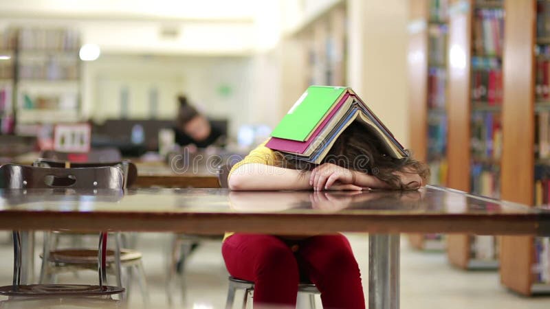 Girl Buried Under Book Stack Stock Footage - Video of book, woman: 37959249
