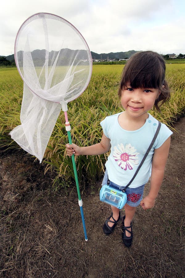 Girl with butterfly net stock photo. Image of farmland - 2830726