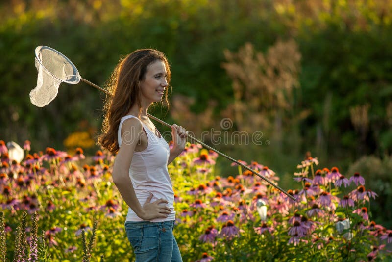 Girl with butterfly net stock photo. Image of outdoors - 75941564