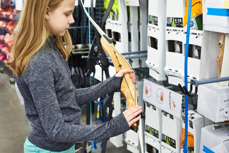 Girl Buys a Bow in Sport Store Stock Photo - Image of archer, human ...