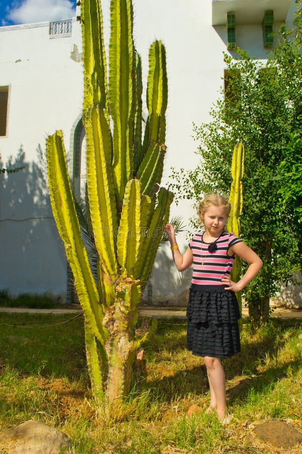 Girl and cactus stock image. Image of smiling, child - 10841537