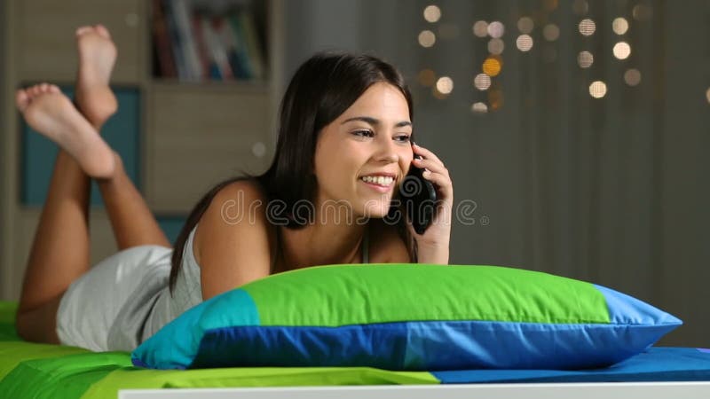 Girl Calling on Phone on a Bed at Home Stock Footage - Video of ...