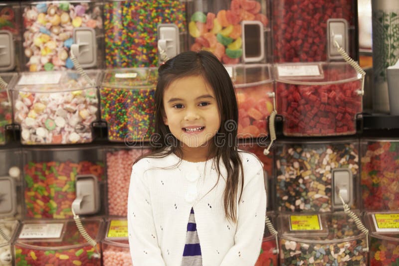 Girl at Candy Counter in Supermarket Stock Image - Image of looking ...