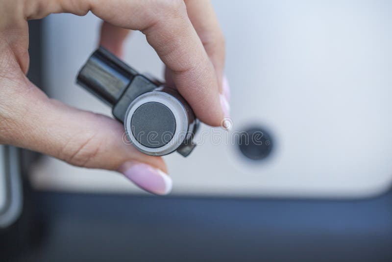 Girl Car Mechanic Changes the Parking Sensor on the Car, the Sensor ...